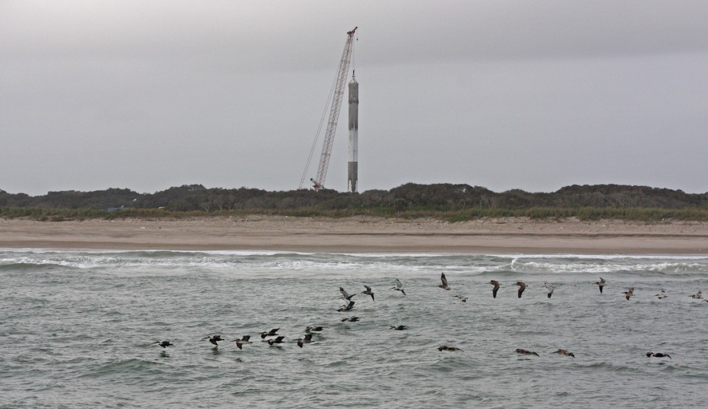 Photos: Falcon 9 booster stands upright after landing – Spaceflight Now