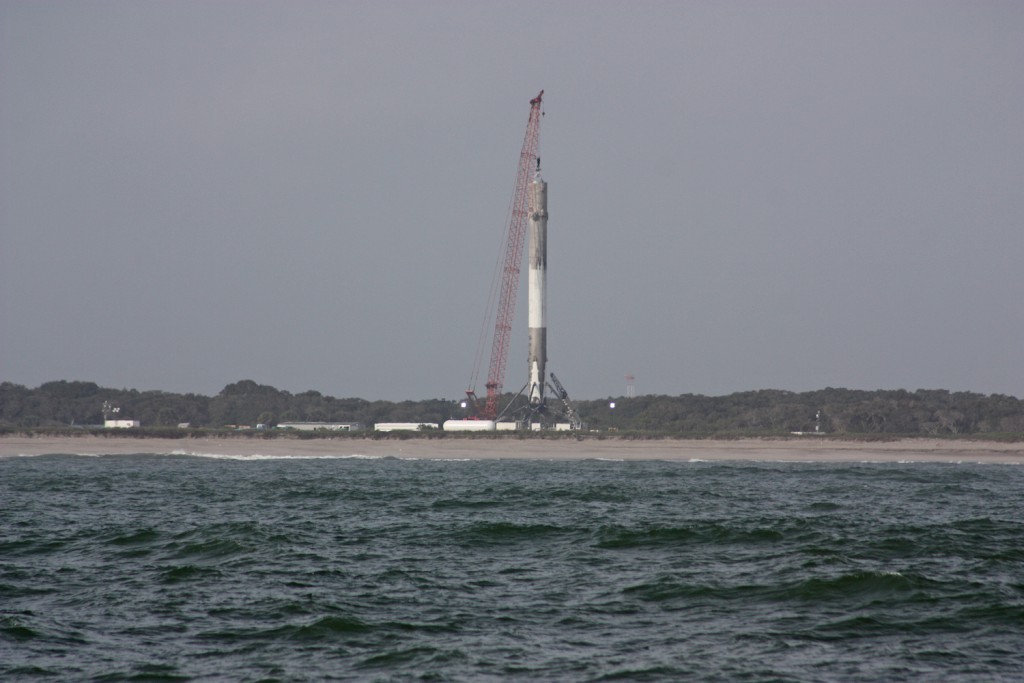 Photos: Falcon 9 booster stands upright after landing – Spaceflight Now