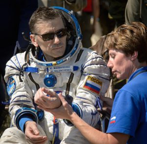 Photos: Soyuz crew capsule parachutes to landing in Kazakhstan ...