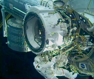 Spacewalkers attach docking adapter to space station for commercial ...