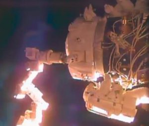 Spacewalkers attach docking adapter to space station for commercial ...