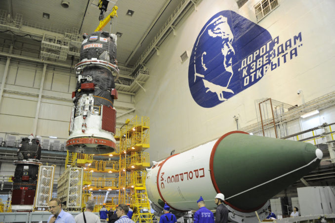 Soyuz booster rolls out for launch with space station cargo freighter ...