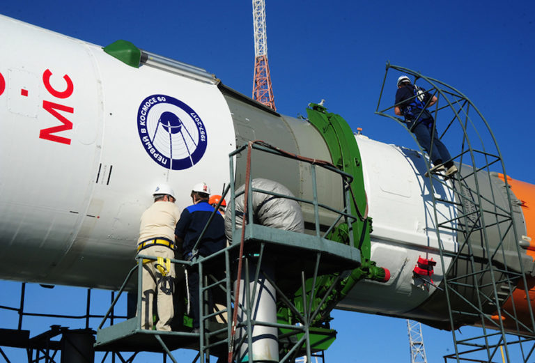 Soyuz booster rolls out for launch with space station cargo freighter ...