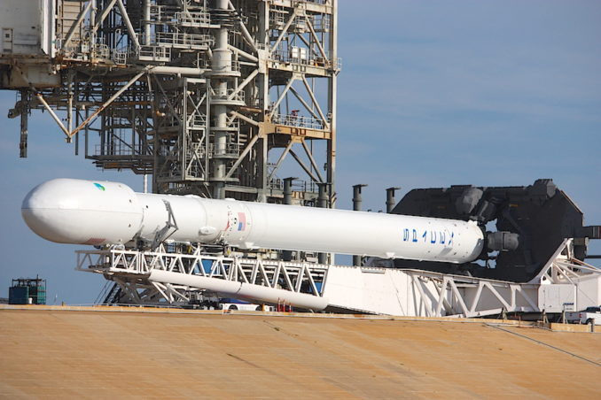 Photos: Expendable Falcon 9 launcher raised vertical at pad 39A ...