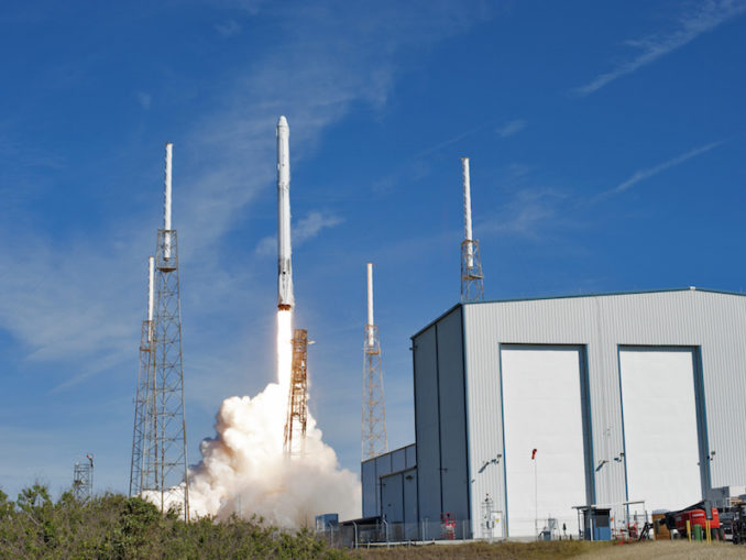 Photos: Falcon 9 booster stands upright after landing – Spaceflight Now