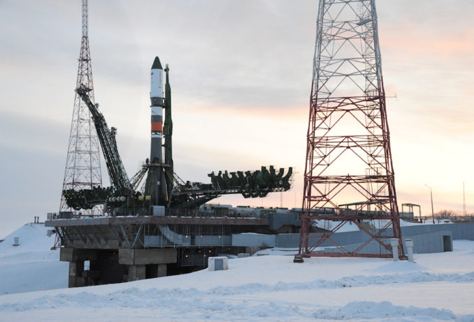 Soyuz rocket positioned on launch pad for station resupply flight ...