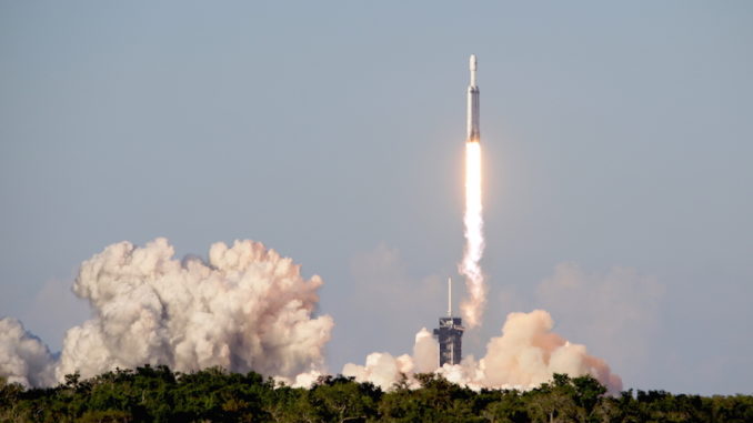 Photos: SpaceX’s Falcon Heavy fires into a clear evening sky ...