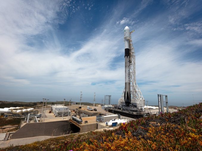 Photos: Falcon 9 booster stands upright after landing – Spaceflight Now