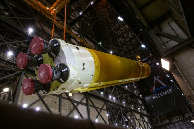 Ground teams begin process to hoist SLS core stage onto its launch ...