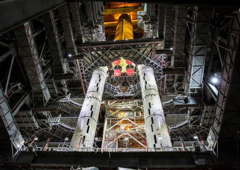 NASA bolts Space Launch System core stage to solid rocket boosters ...